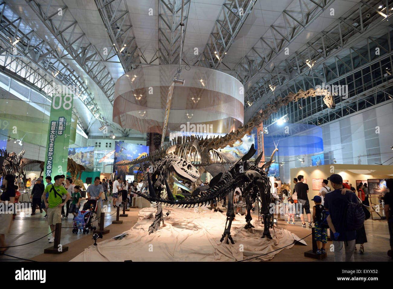 Tokyo, Japan. 18th July, 2015. People look at replicas of dinosaur ...