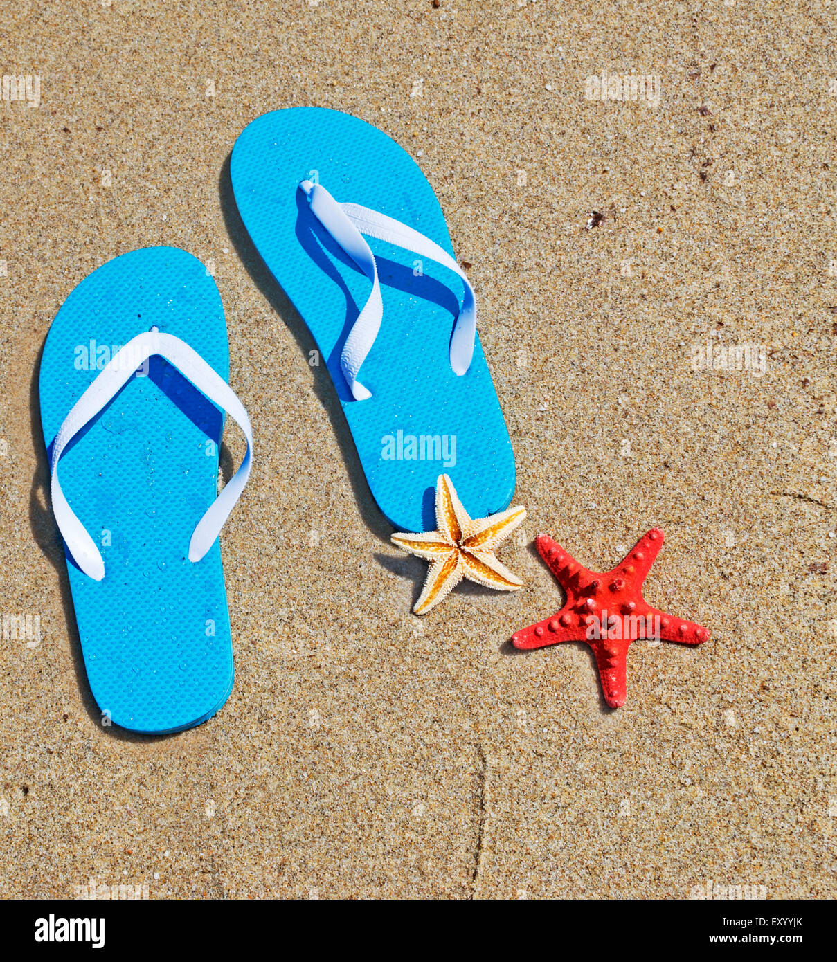 blue flip flops and starfish by the sea Stock Photo - Alamy