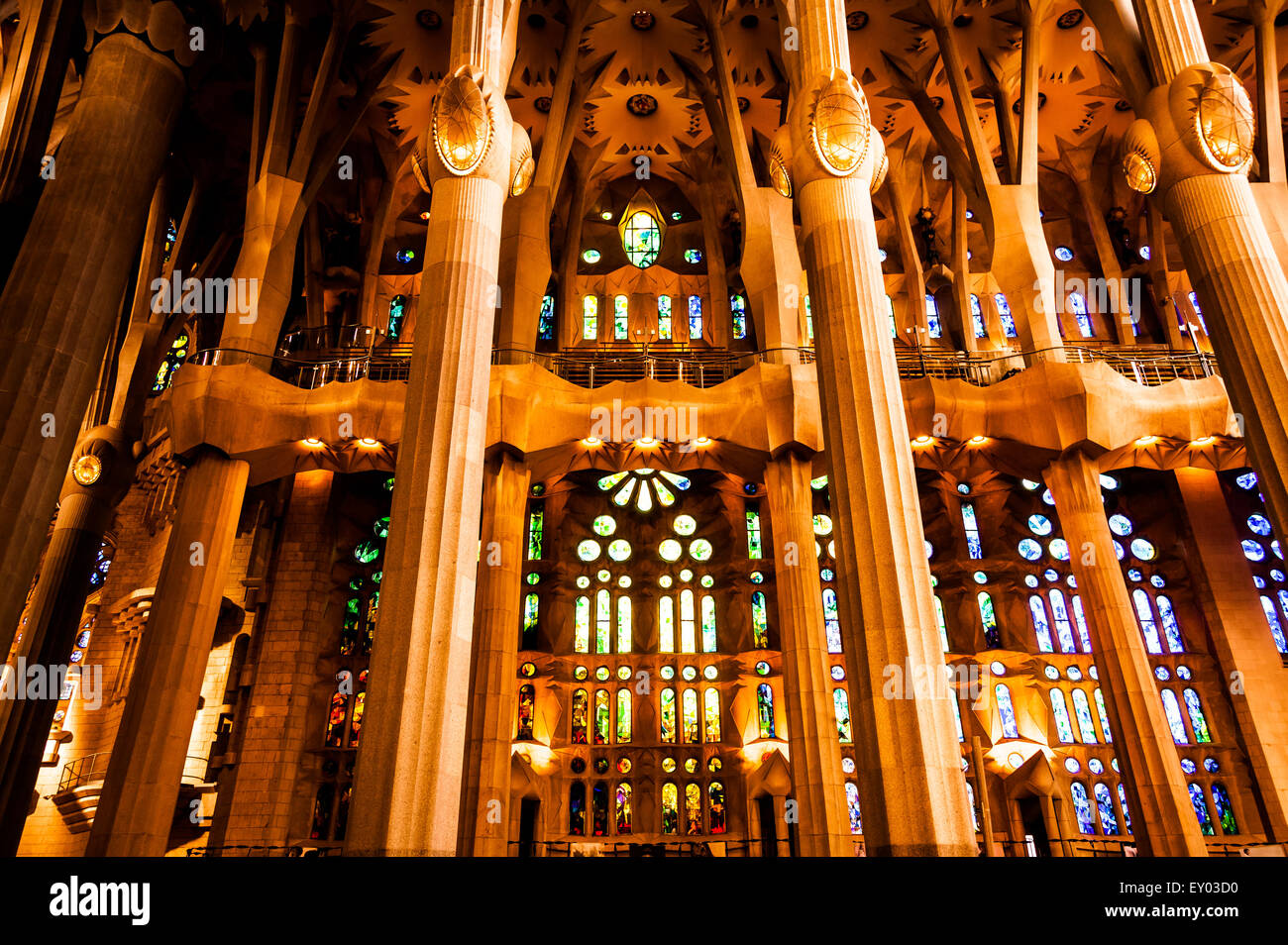 The sun shines through the stained glass windows of Gaudi's masterpiece ...