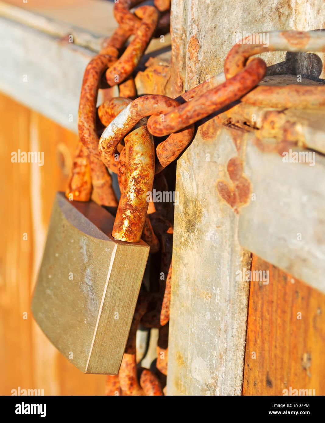 rusty padlock on a wooden gate Stock Photo - Alamy