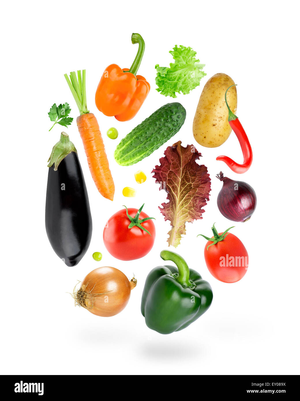 Falling fresh color vegetables on white background Stock Photo - Alamy