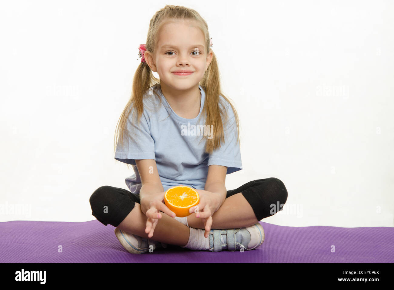 Six year old girl Europeans engaged in physical exercises Stock Photo ...