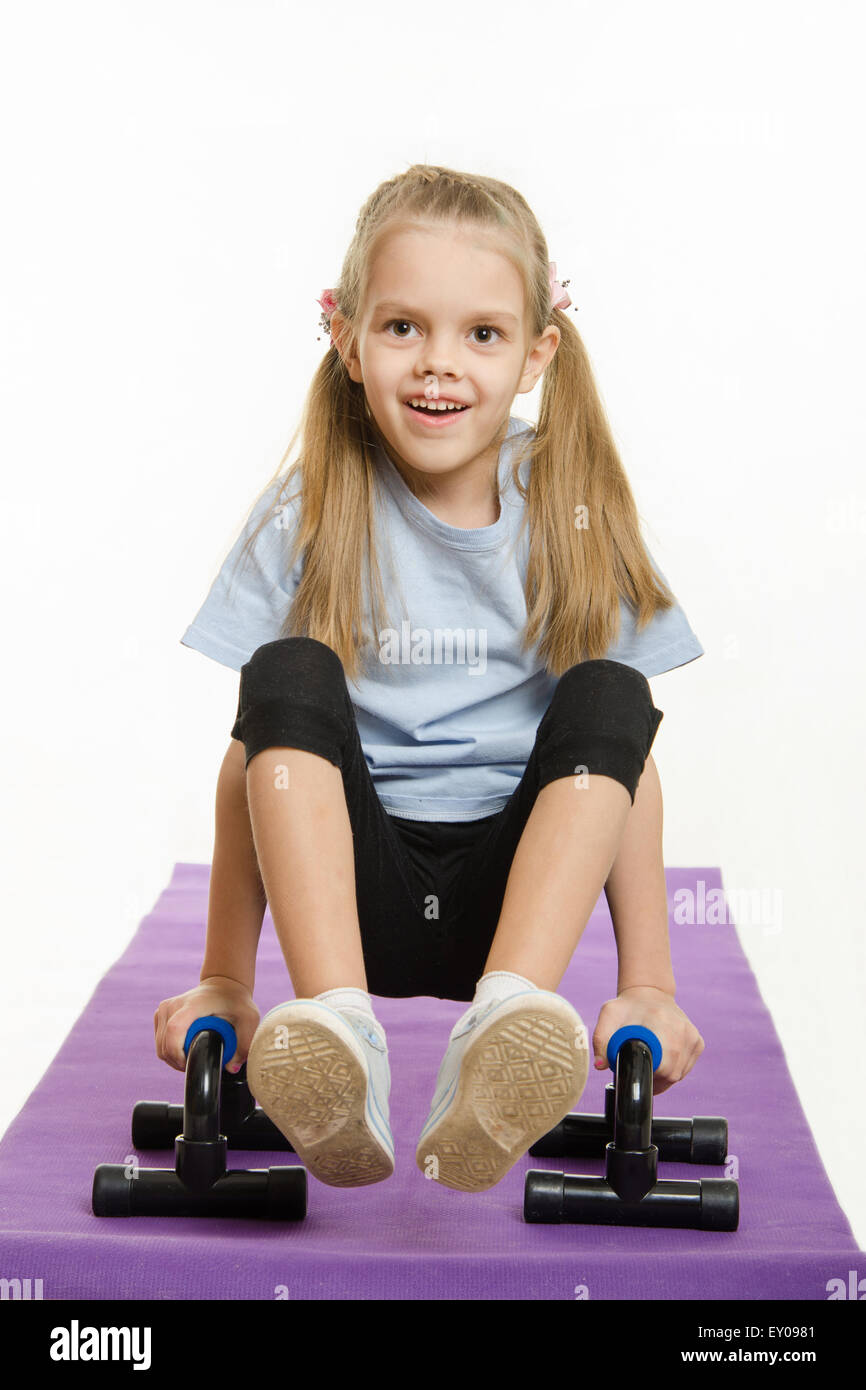 Six year old girl Europeans engaged in physical exercises Stock Photo ...