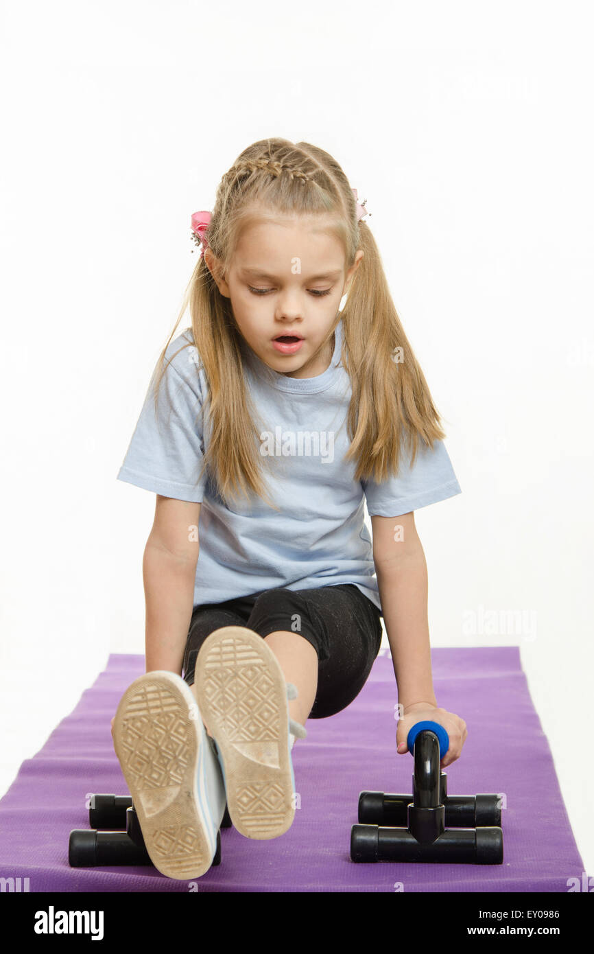Six year old girl Europeans engaged in physical exercises Stock Photo ...