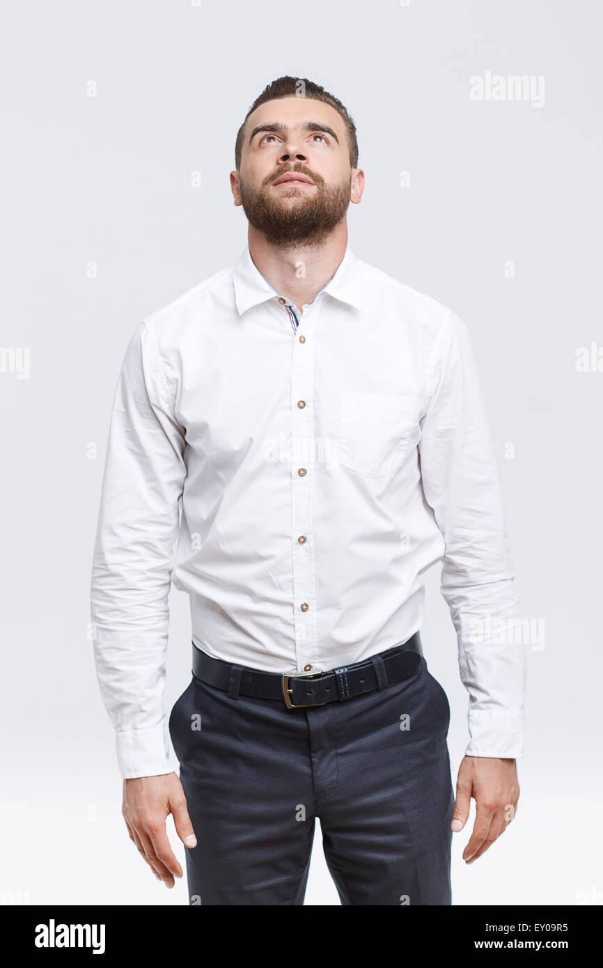 Man with beard standing and looking up Stock Photo - Alamy