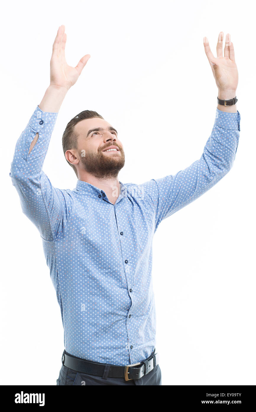 Cheering man with raised arms Stock Photo - Alamy