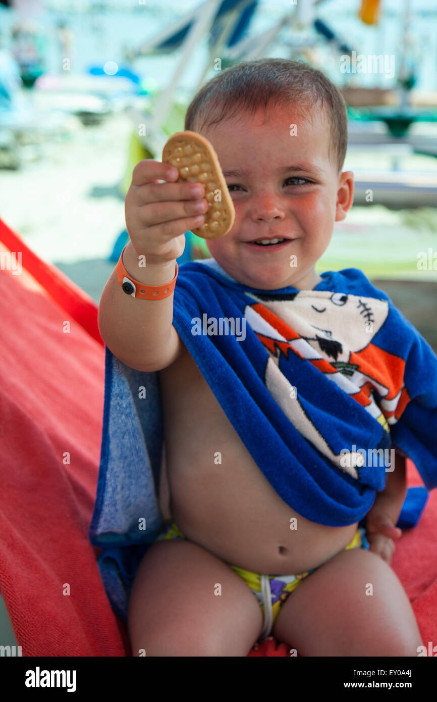 Baby eating biscuit hi-res stock photography and images - Alamy