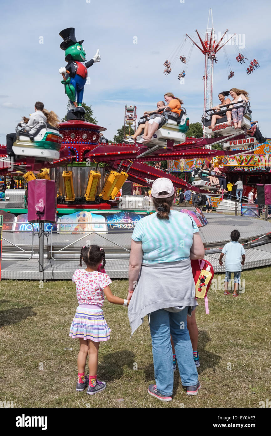 Mother with kids at funfair Stock Photo - Alamy