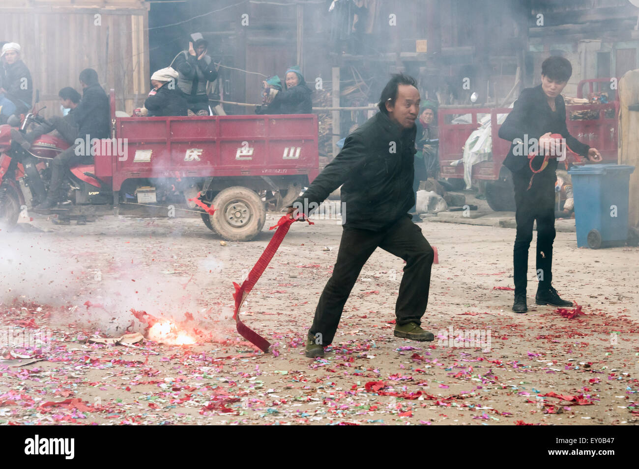 Man running with lit firecrackers hi-res stock photography and images ...