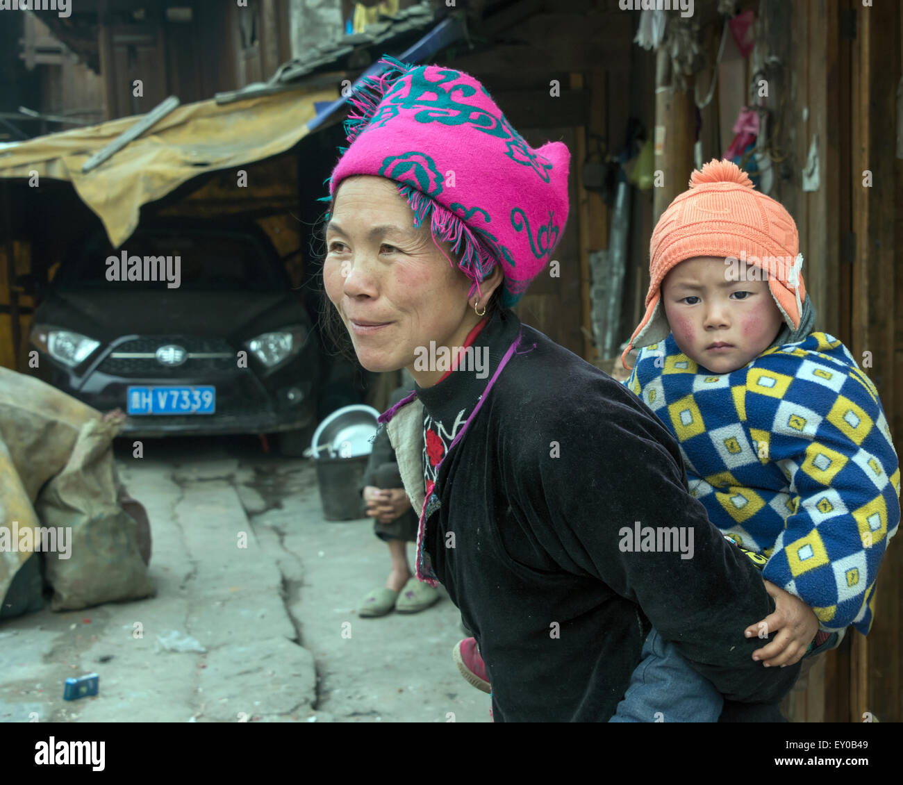 Smiling Dong mother with baby, Huanggang Dong Village, Guizhou Province ...