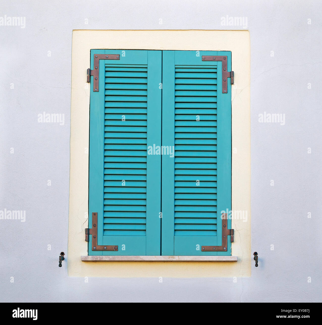 turquoise window in a white wall Stock Photo - Alamy