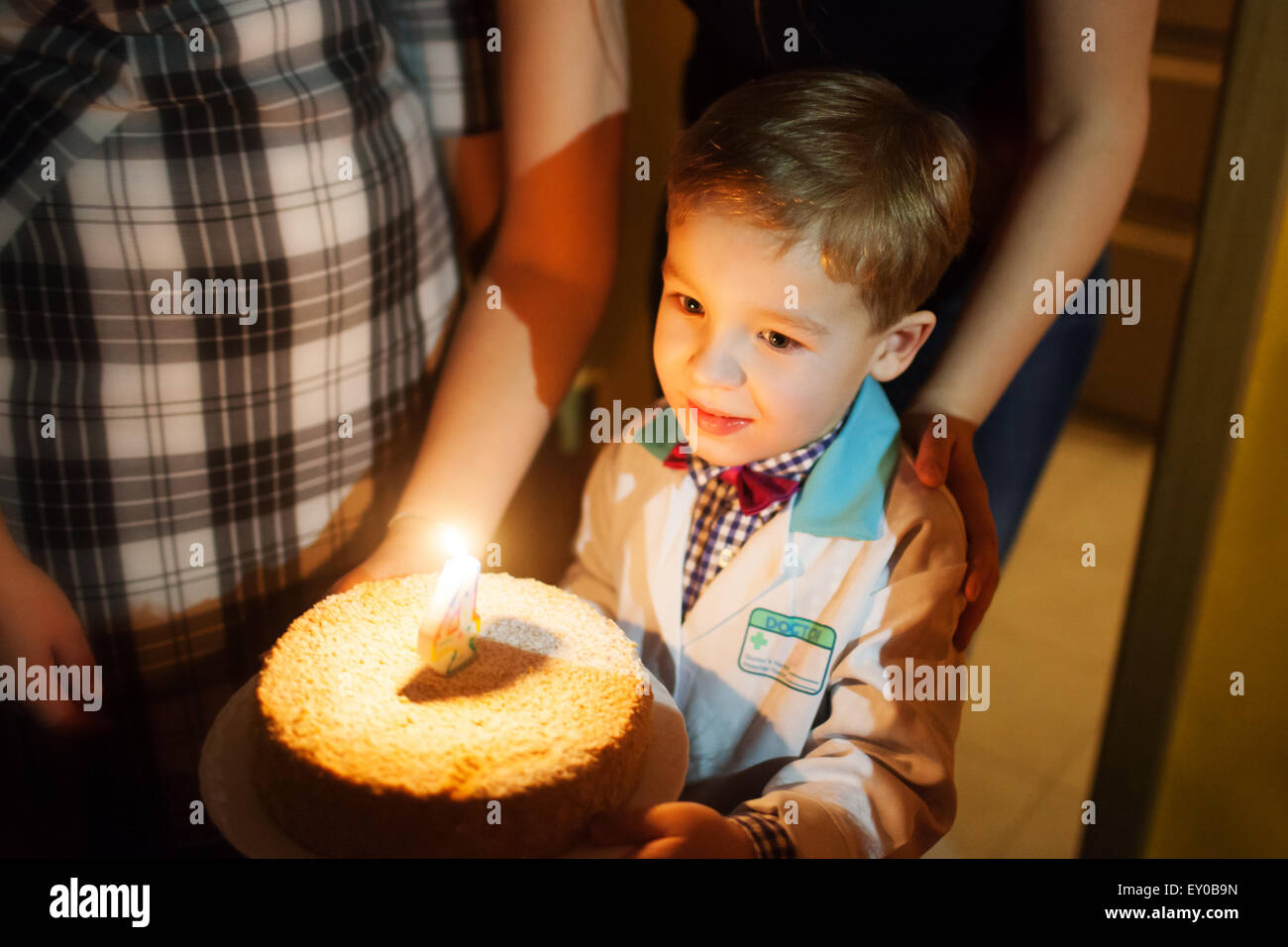 Boy carrying cake hi-res stock photography and images - Alamy