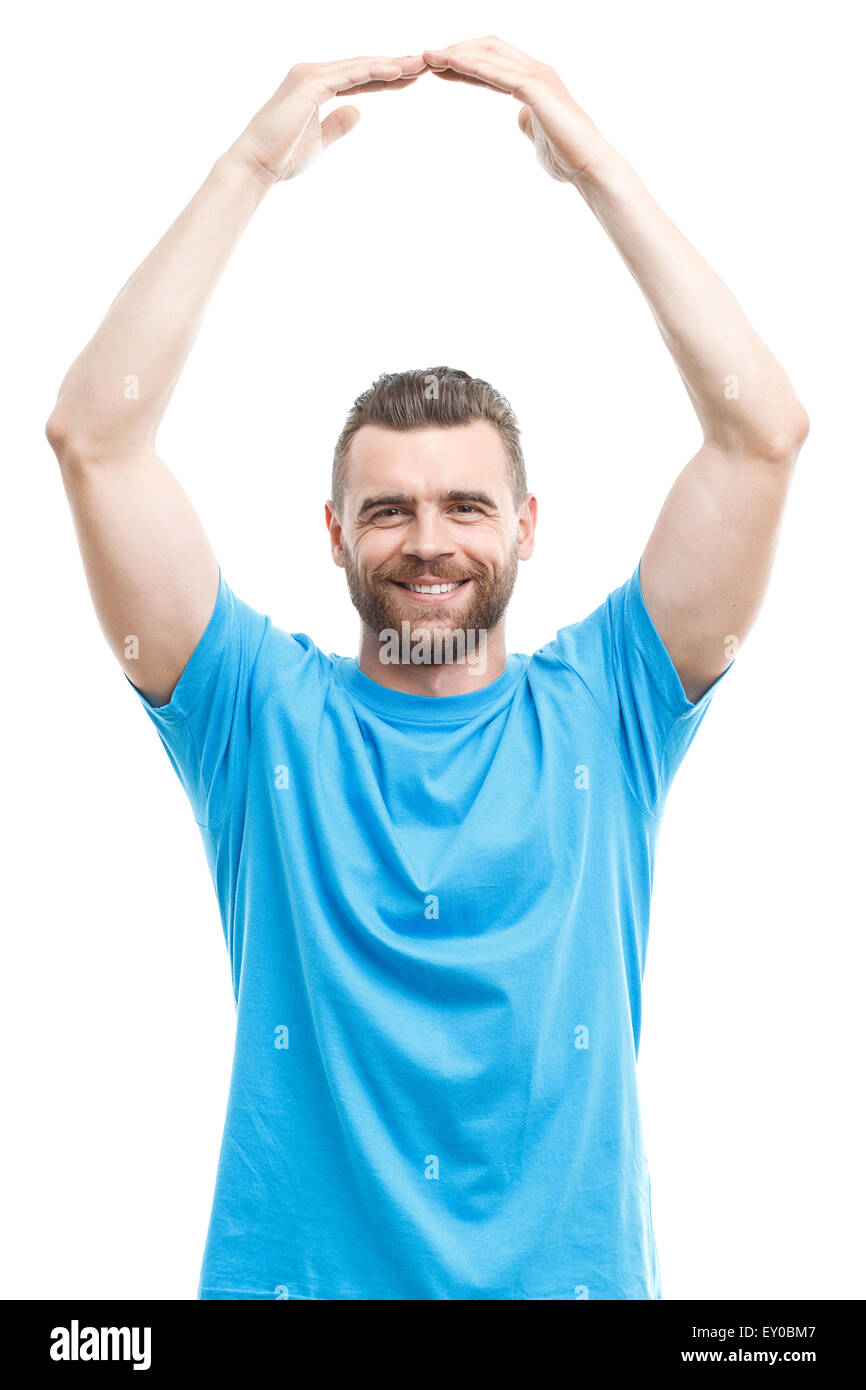 Smiling man holding arms above his head Stock Photo - Alamy