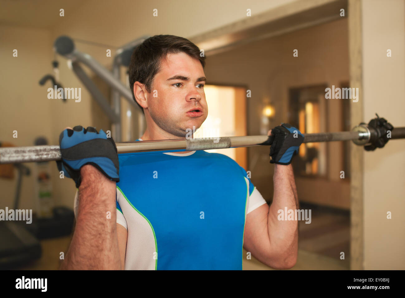 Strong person with bar bell hi-res stock photography and images - Alamy