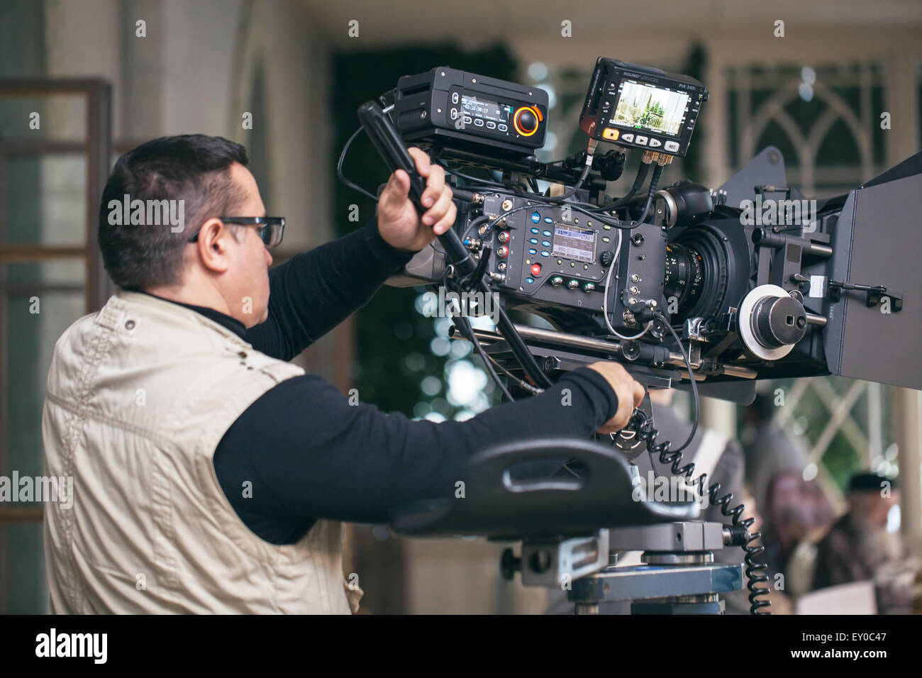 Professional camera man at work Stock Photo - Alamy