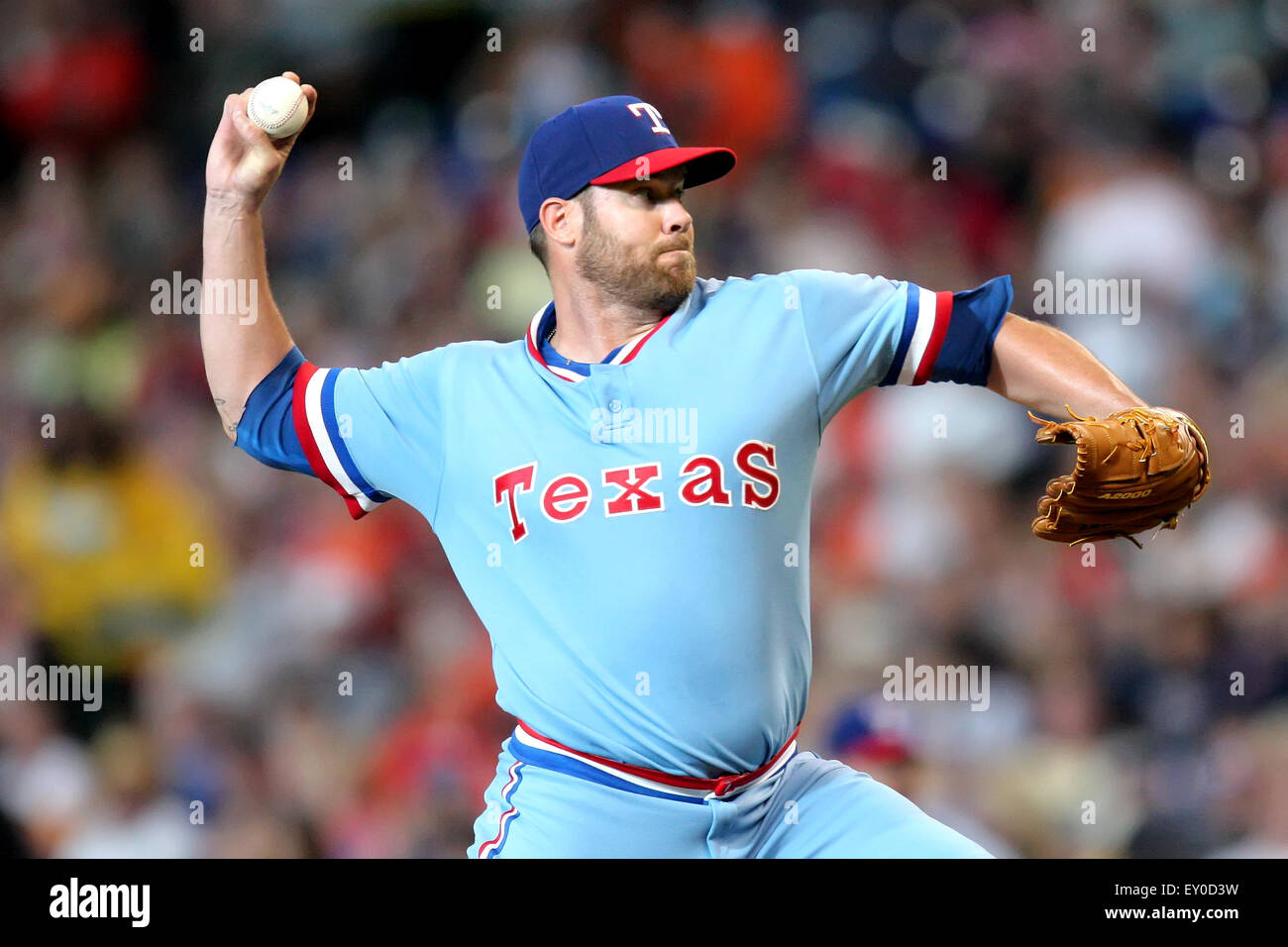 Houston, TX, USA. 18th July, 2015. Texas Rangers starting pitcher Colby Lewis (48) delivers a ...