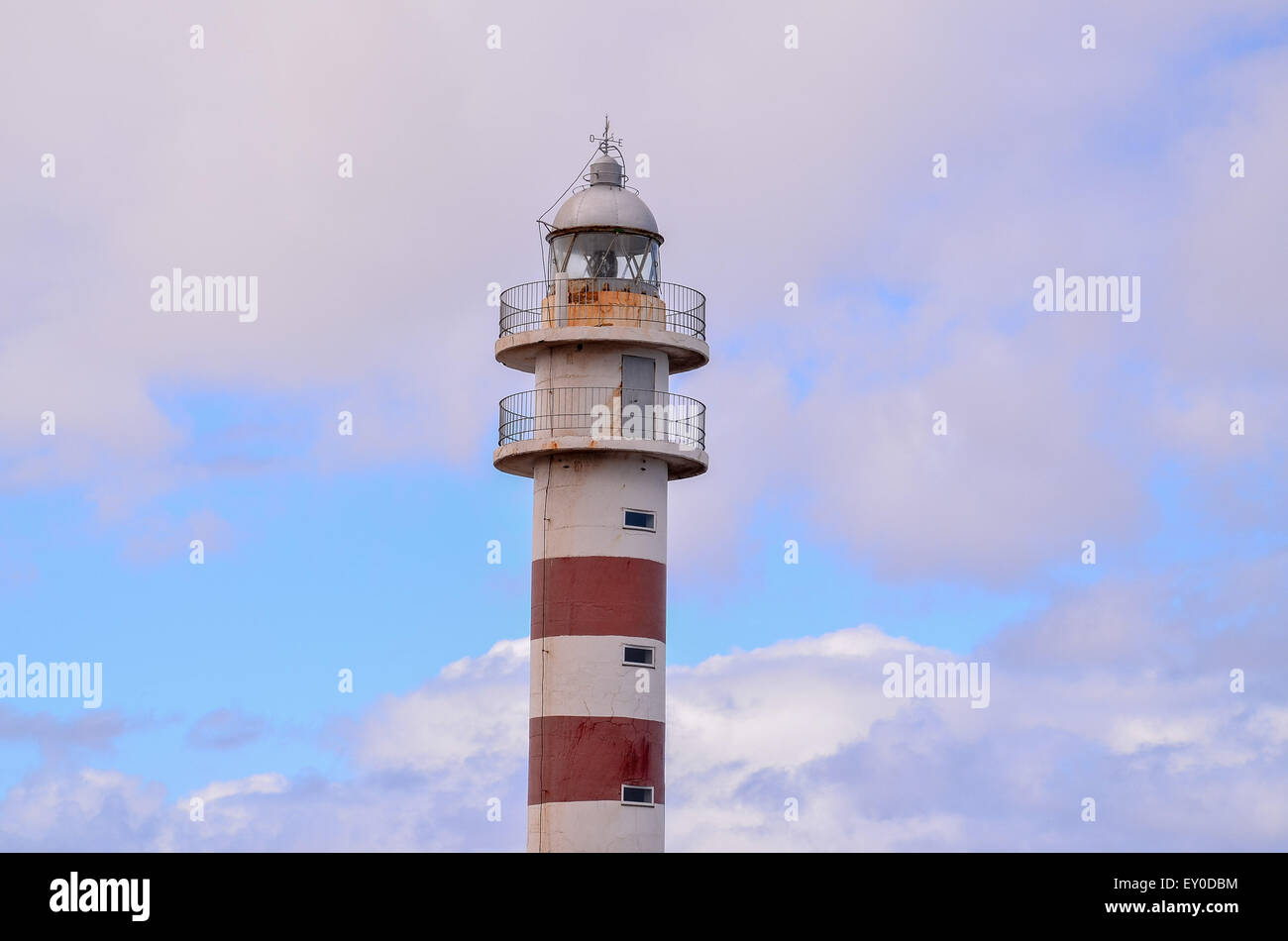 High Lighthouse near the Coast Stock Photo - Alamy