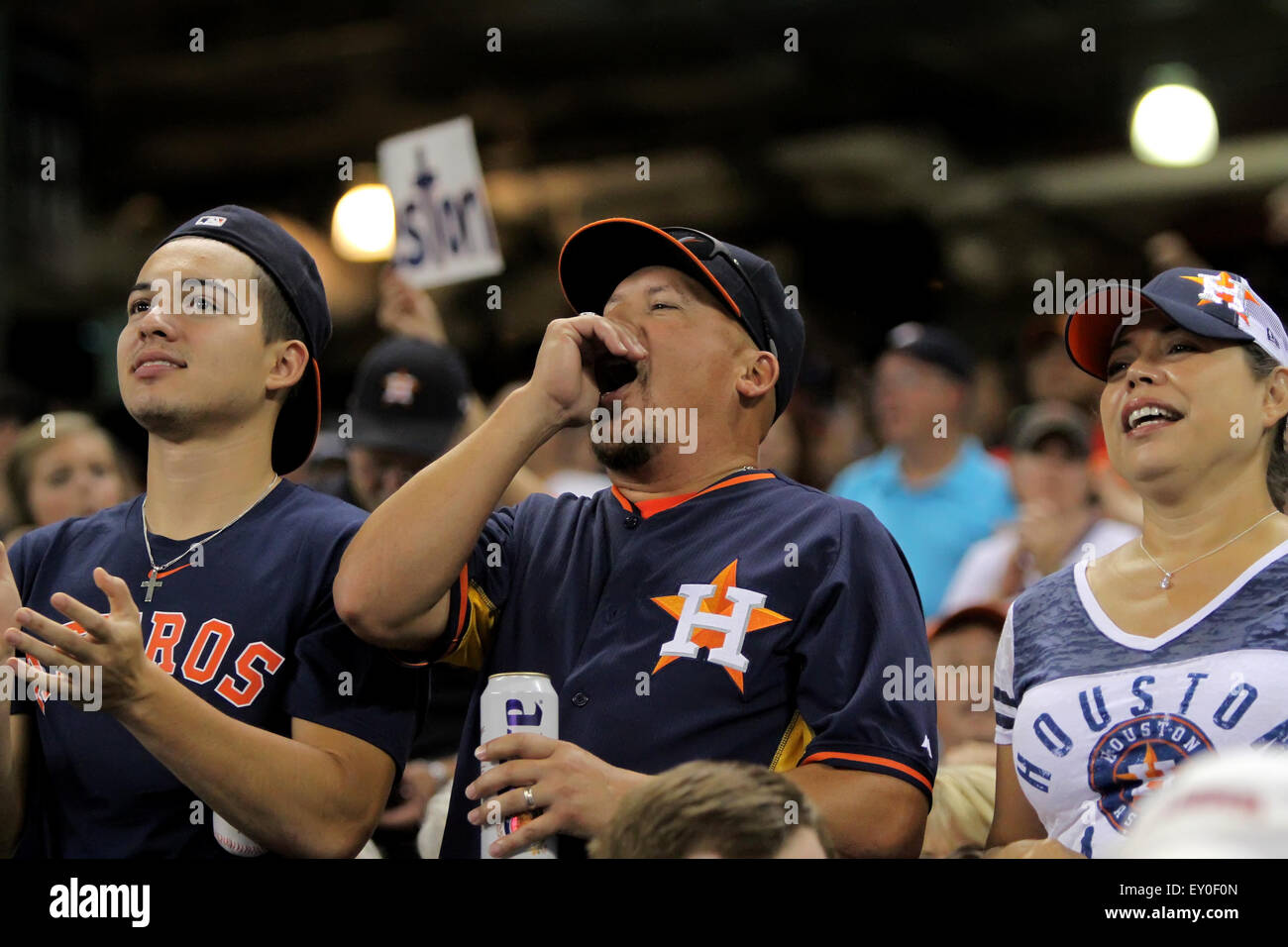 Houston, TX, USA. 18th July, 2015. Houston Astros fans cheer a scored ...