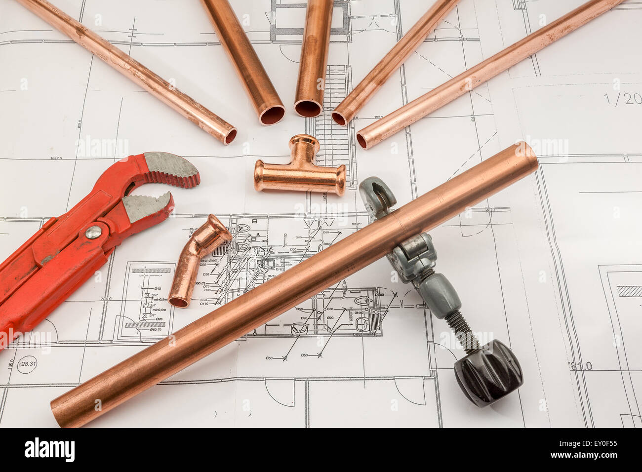 Plumbing Tools Arranged On House Plans whit wrench and pipe cutter ...