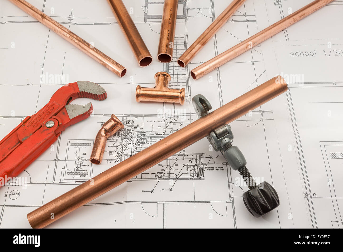 Plumbing Tools Arranged On House Plans whit wrench and pipe cutter ...