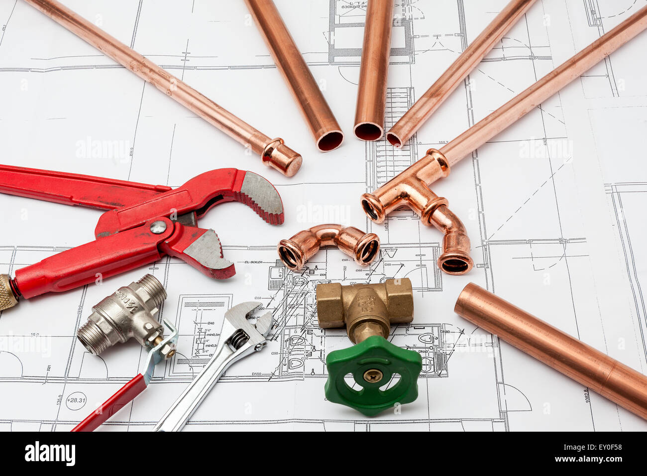 Plumbing Tools Arranged On House Plans whit wrench and pipe cutter ...