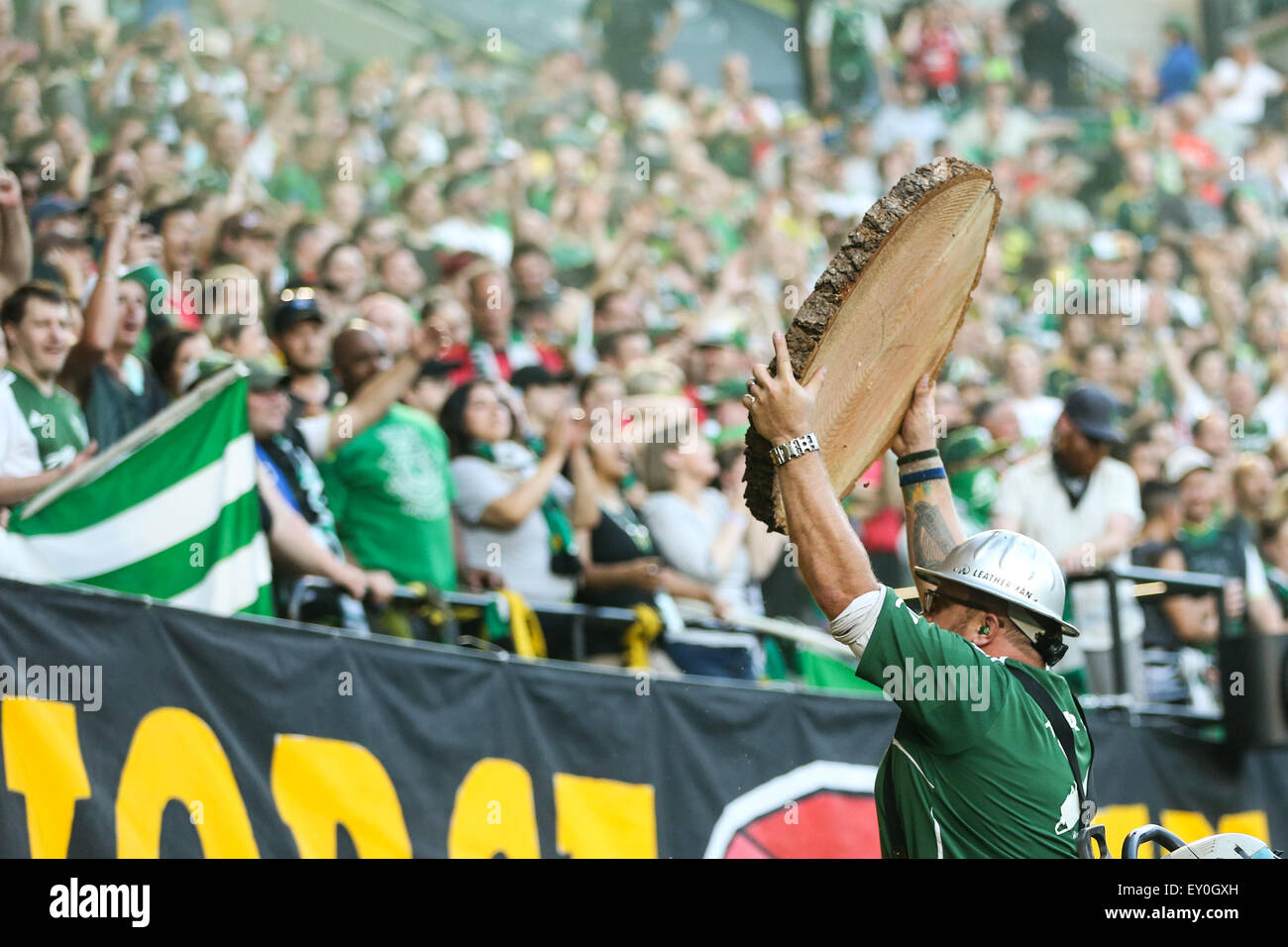 TIMBER JOEY holds up a log slice to the Timbers Army. The Portland ...