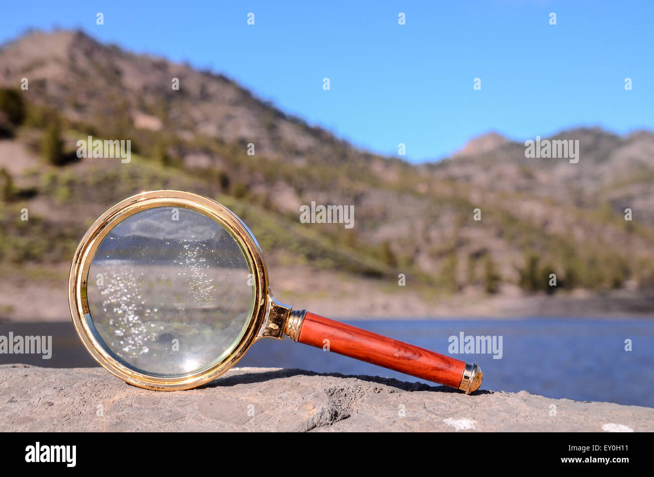 Magnify Glass Loupe on the Volcanic Rock Stock Photo - Alamy