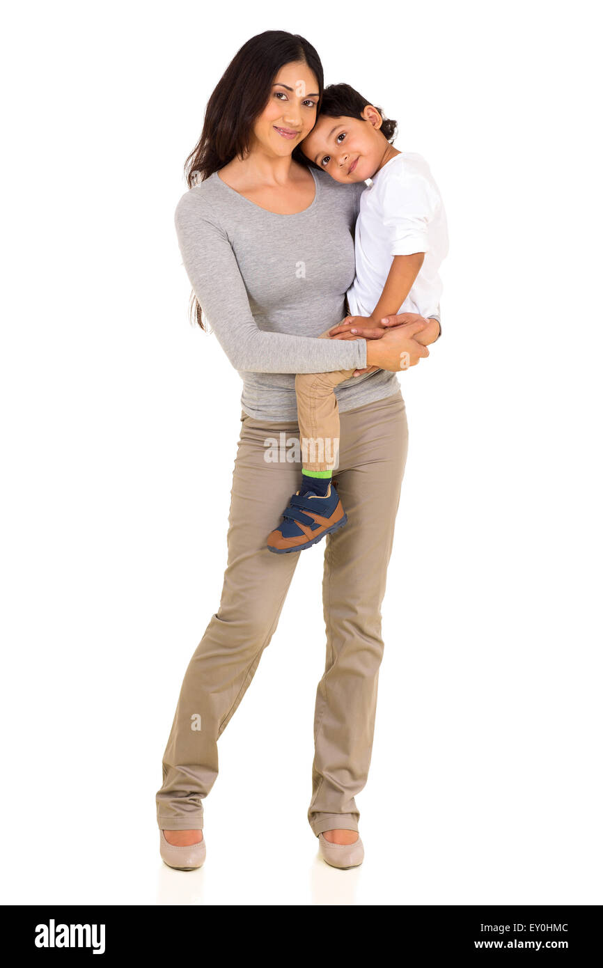 loving young Indian mother holding her son on white background Stock Photo - Alamy