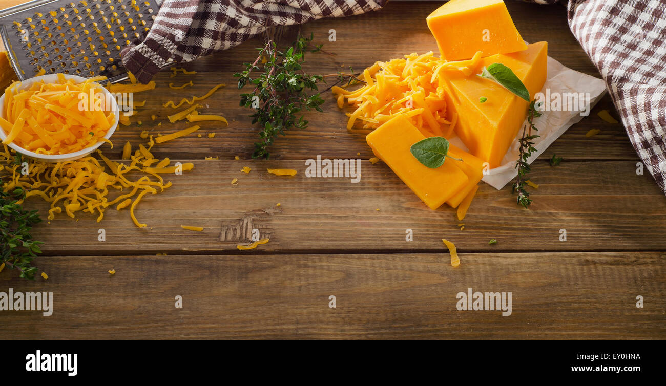 Cheddar Cheese on a rustic wooden background. Top view Stock Photo - Alamy