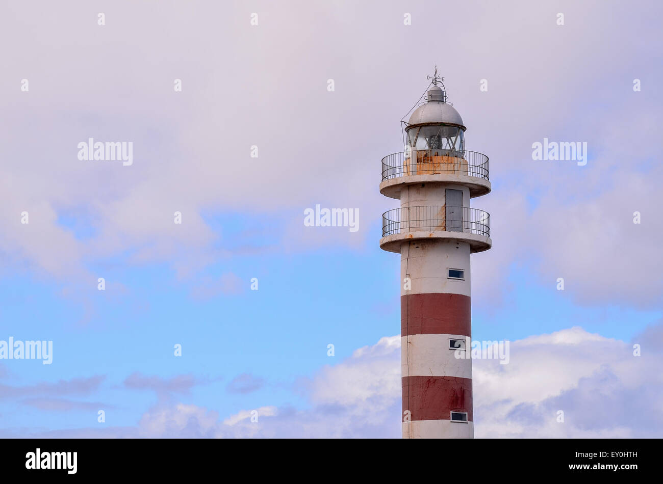 High Lighthouse near the Coast Stock Photo - Alamy