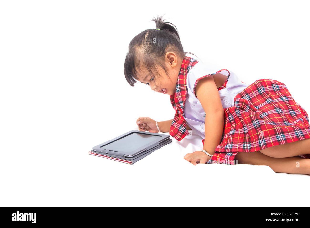 Happy child using digital Cut Out Stock Images & Pictures - Alamy