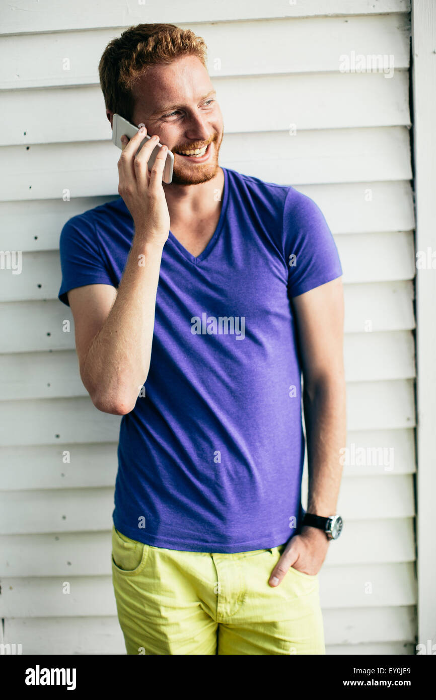 Young man with mobile phone Stock Photo - Alamy