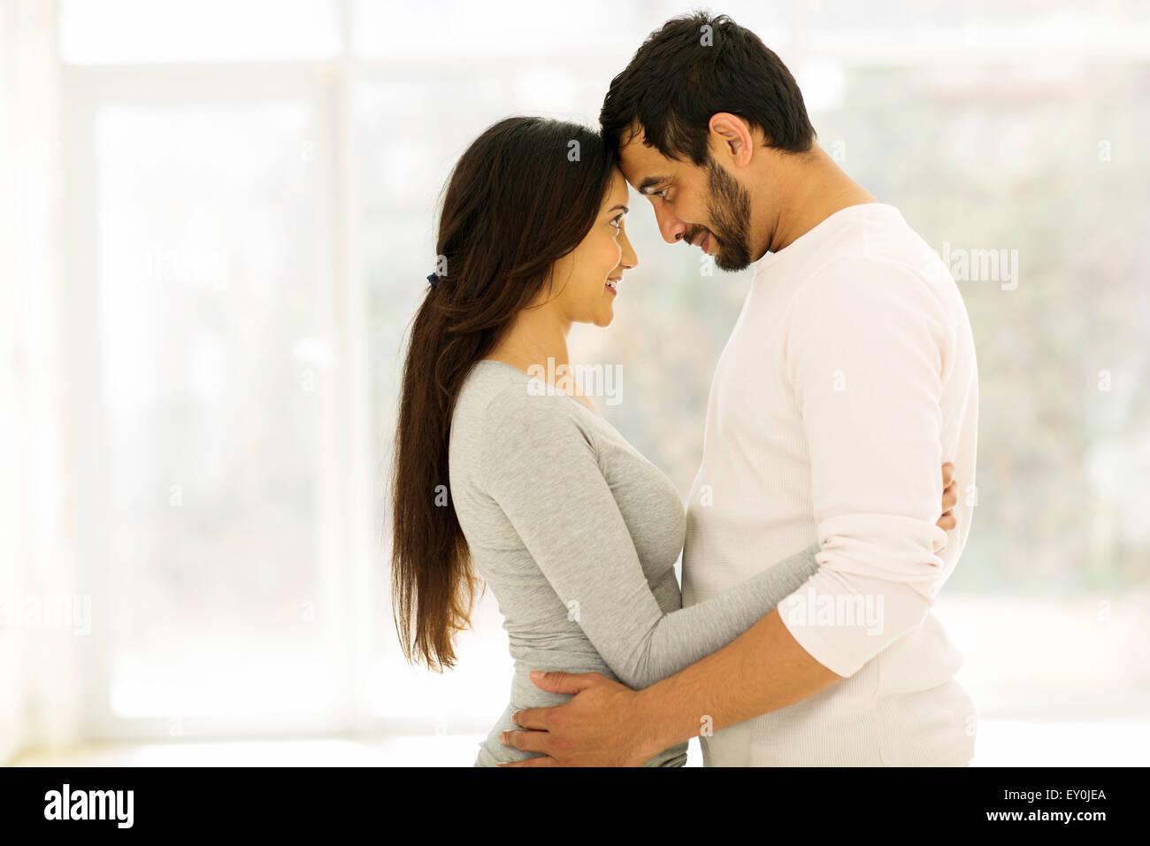 Couple hugging home hi-res stock photography and images - Alamy