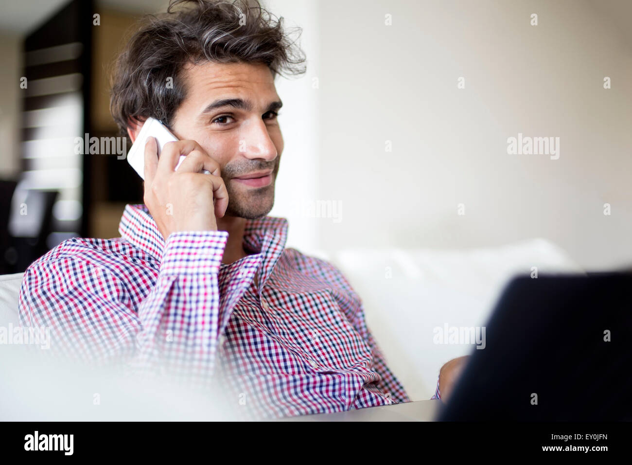 Handsome young man on the mobile phone Stock Photo - Alamy