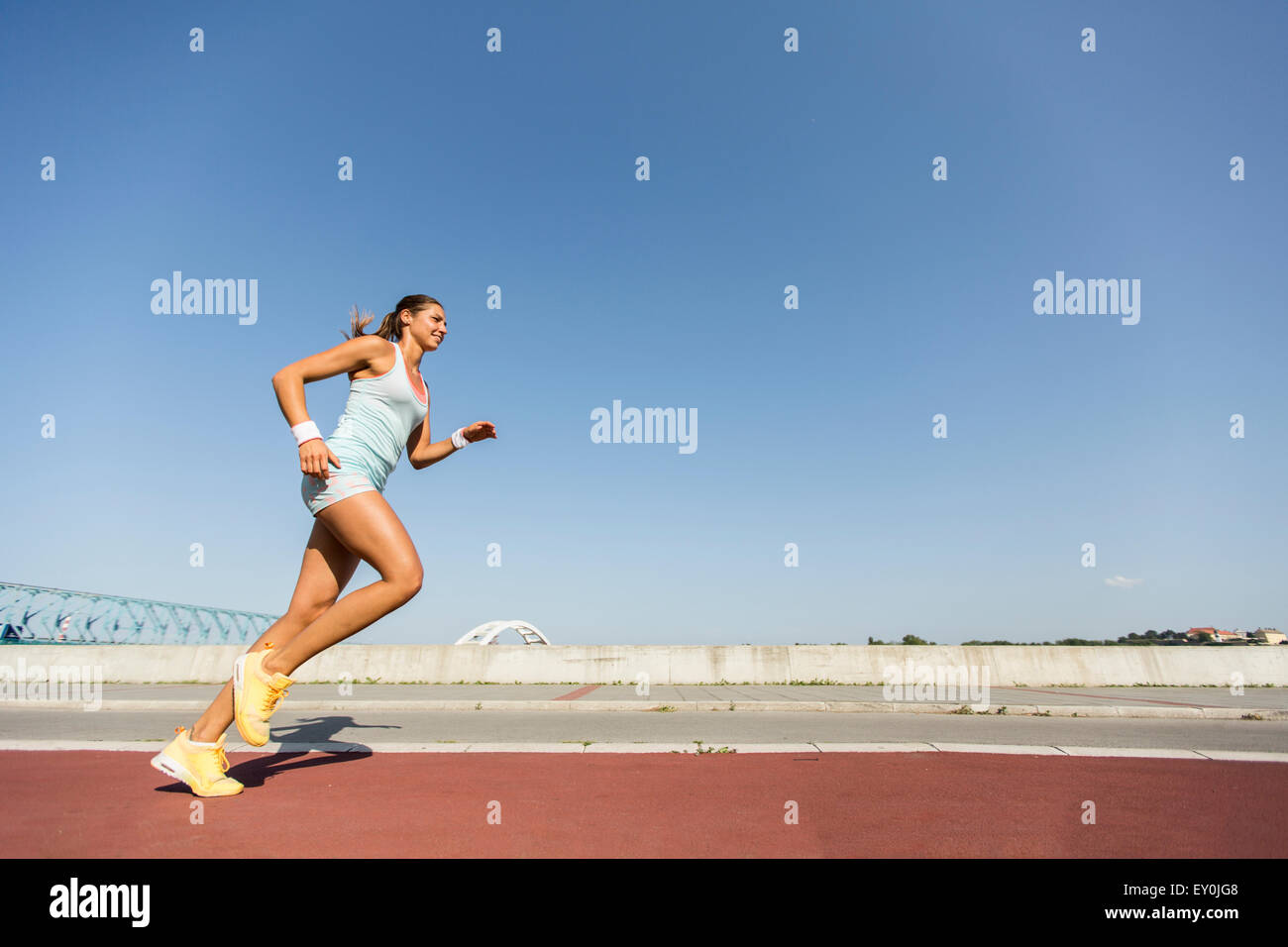 Young woman running Stock Photo - Alamy