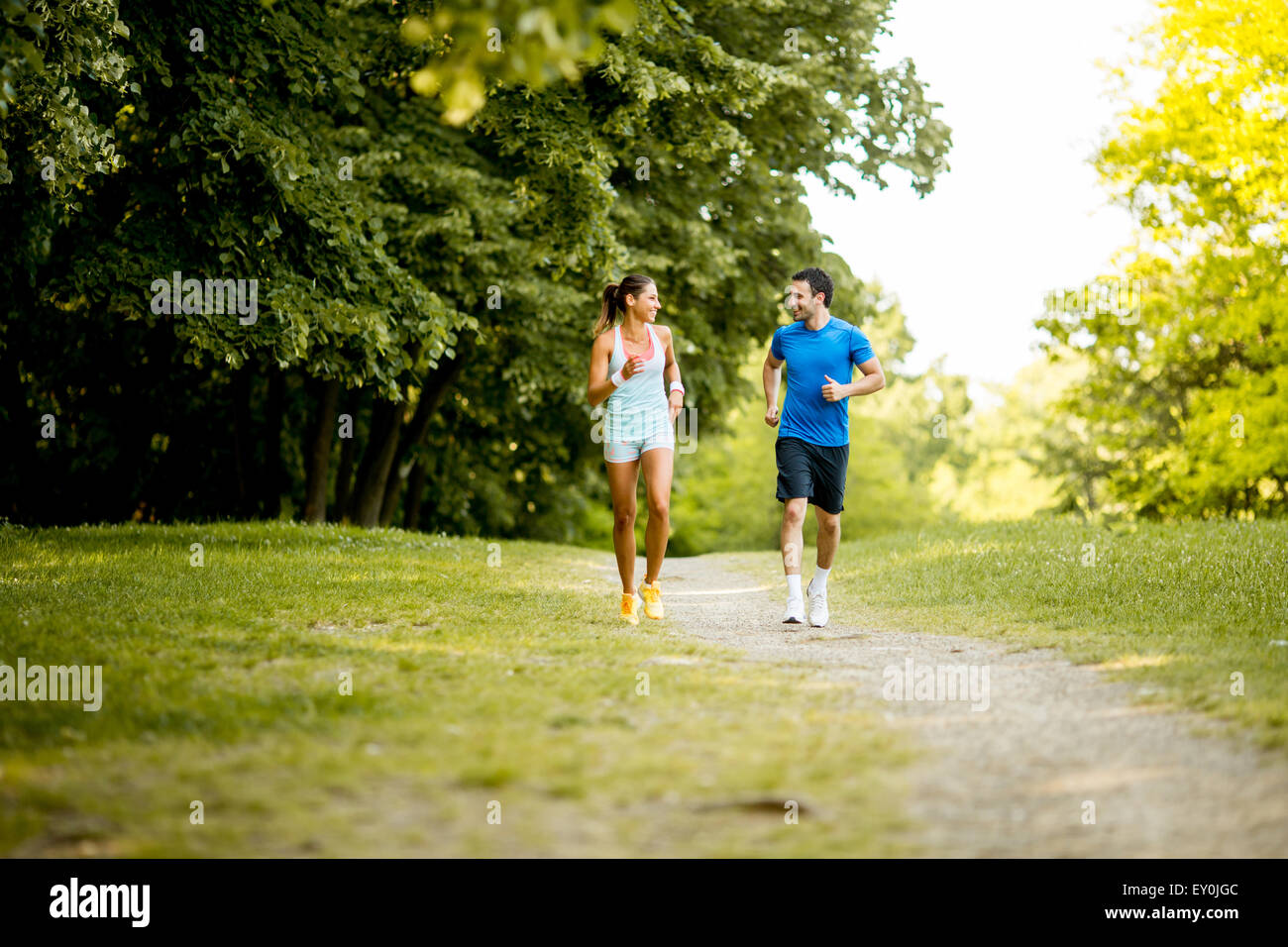 Young couple running Stock Photo - Alamy