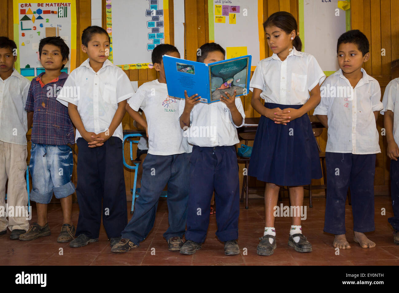 Children reading a tales book at classroom in a school in the rural ...