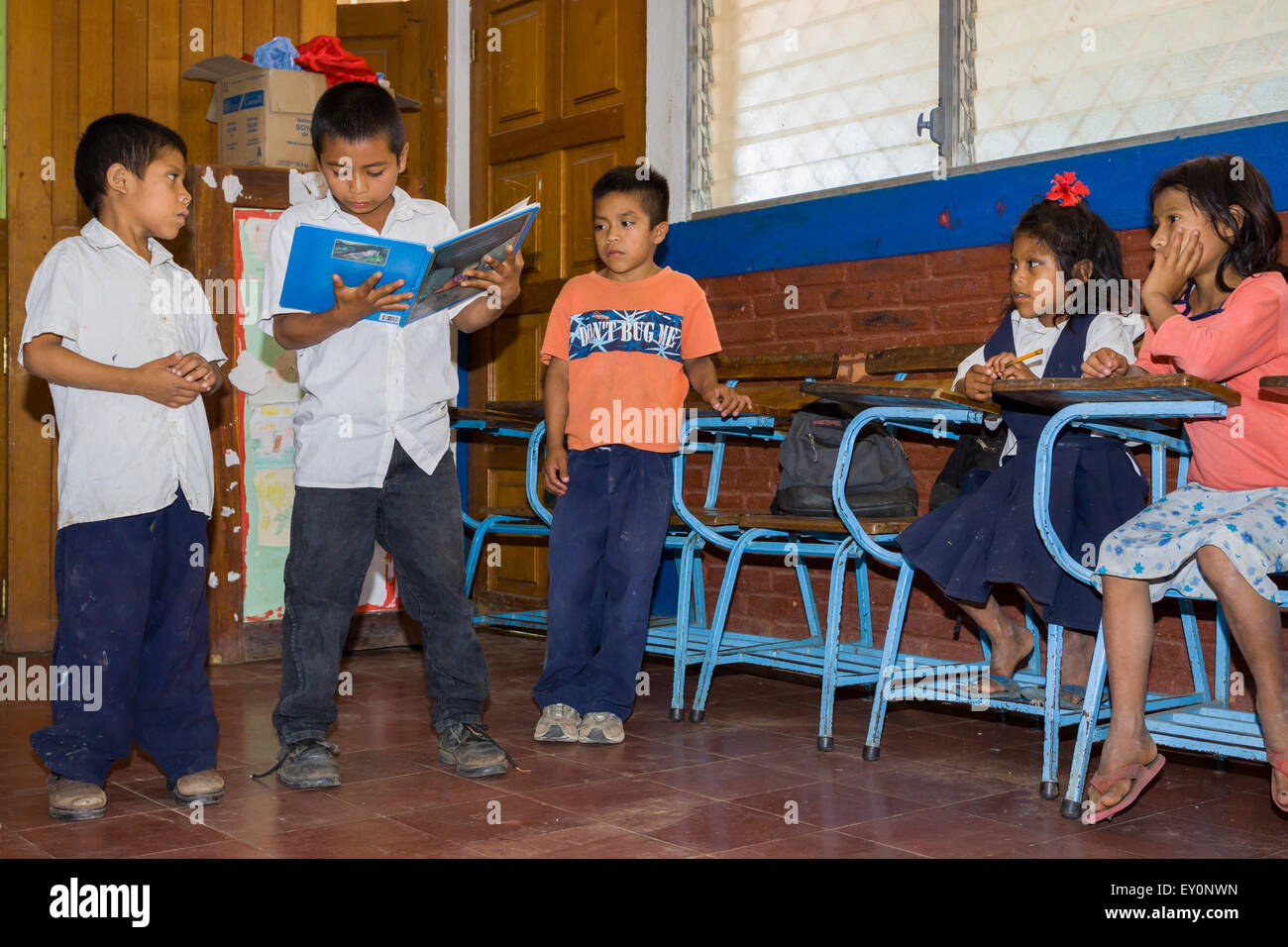 Children reading a tales book at classroom in a school in the rural ...
