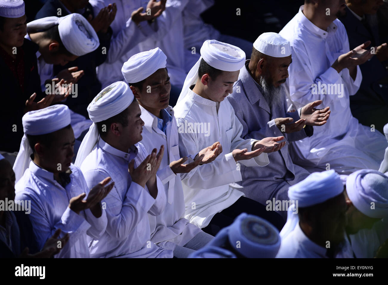 Beijing, China's Qinghai Province. 17th July, 2015. Muslims pray for ...