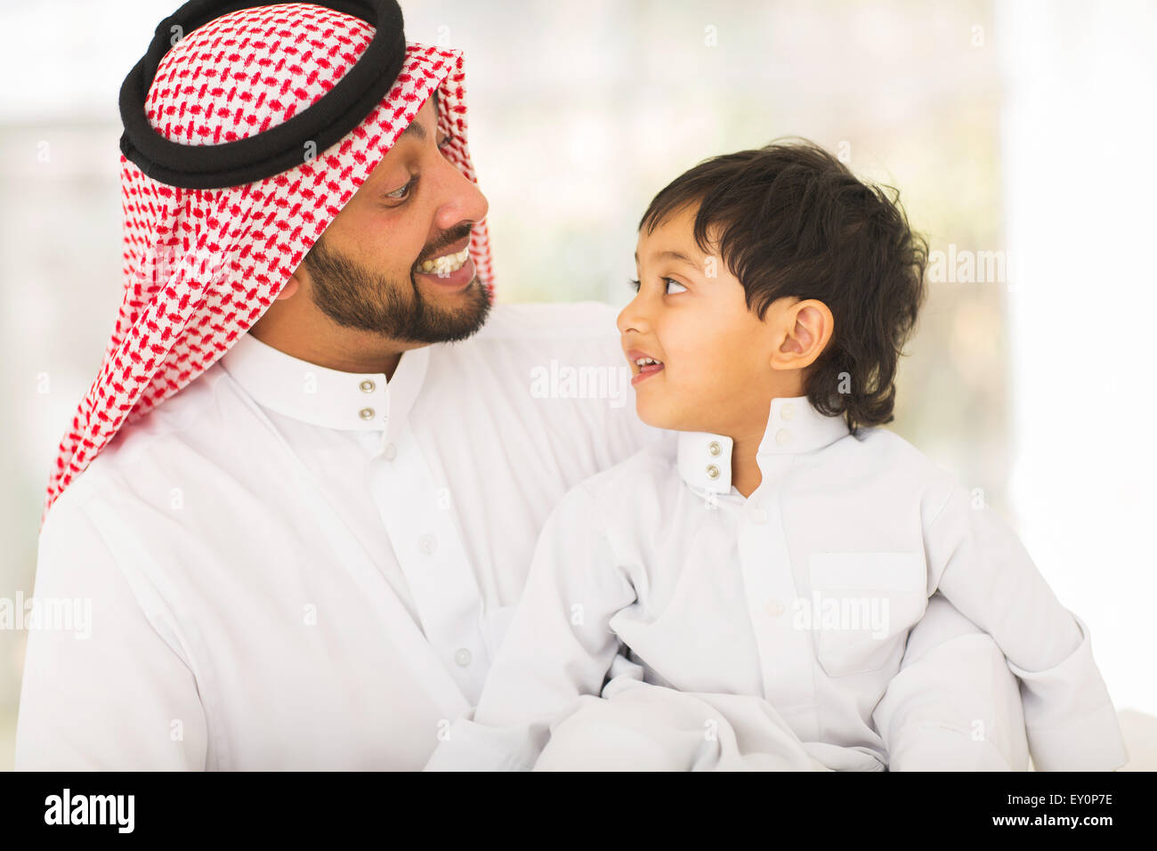 playful middle eastern father and son Stock Photo - Alamy