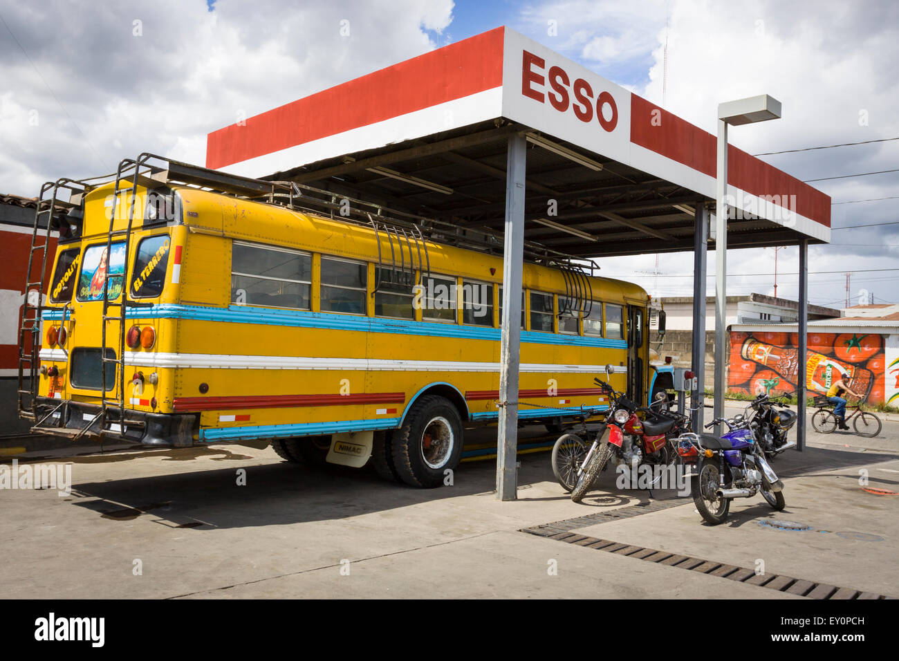 Yellow bus at Esso Petrol Station in Estelí, Nicaragua Stock Photo - Alamy