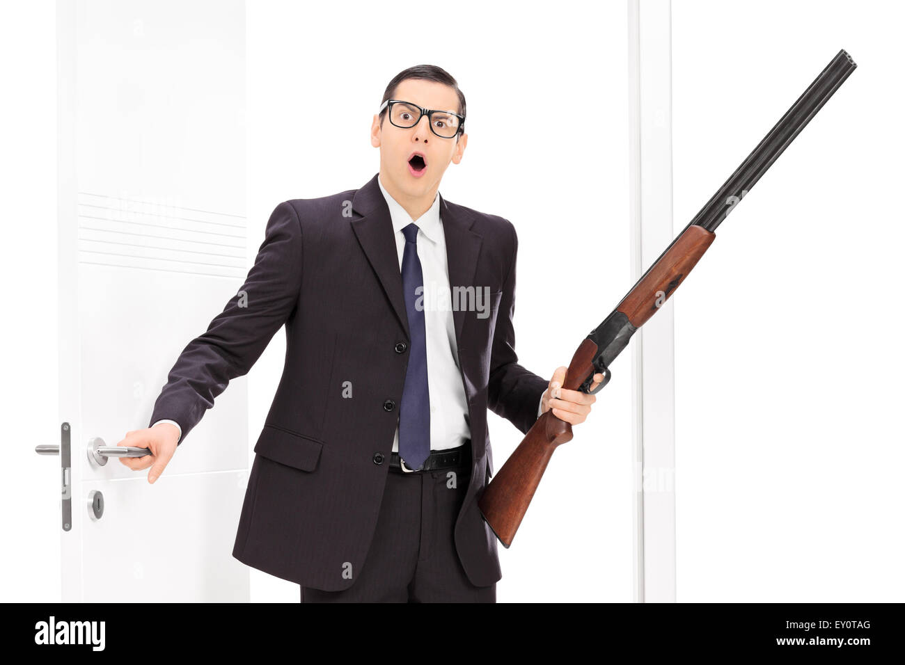 Man with rifle standing by a door isolated on white background Stock ...