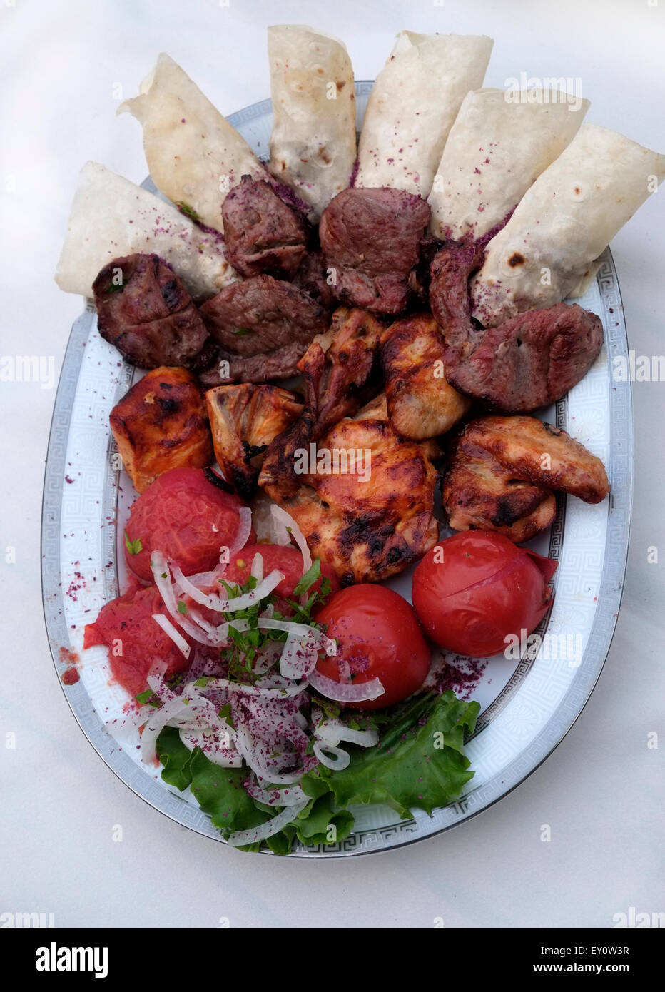 Lamb and chicken served with Lavash a thin unleavened flatbread made in ...