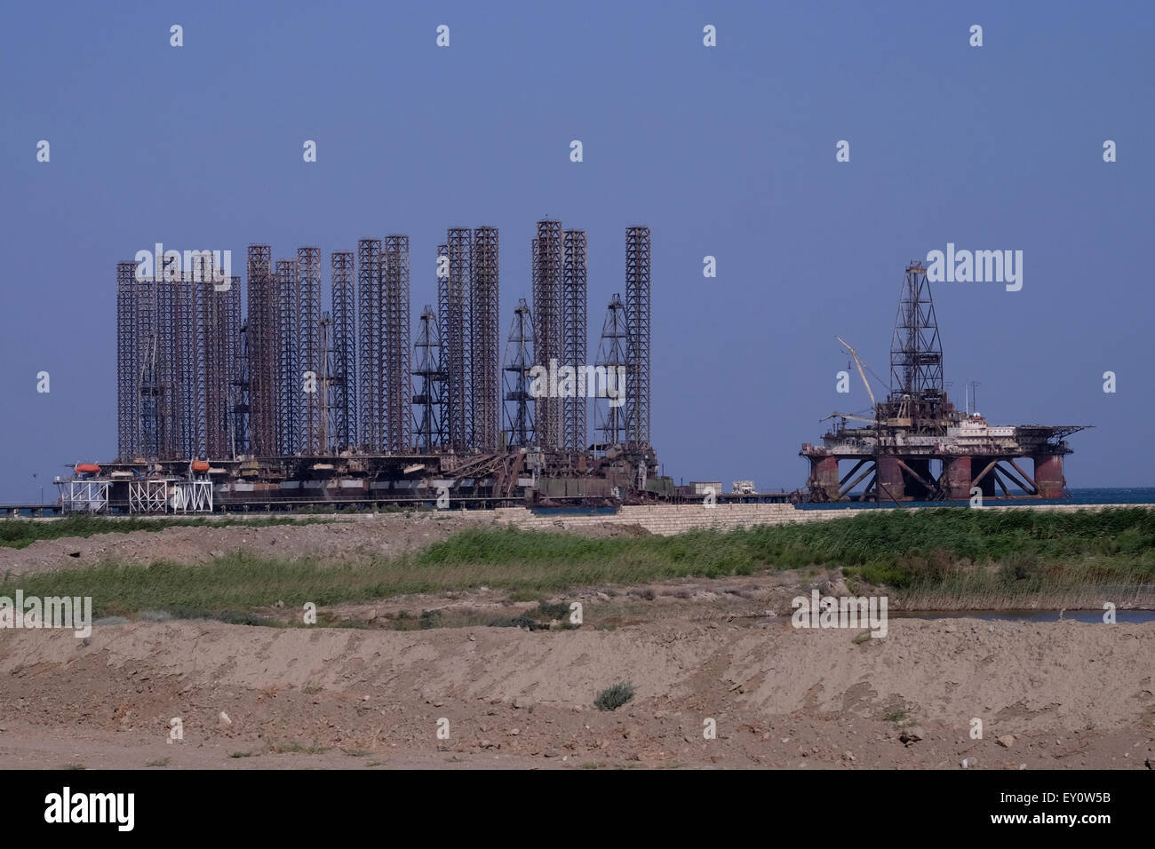 Soviet oil rig platform on the shore of the Caspian Sea in the city of ...