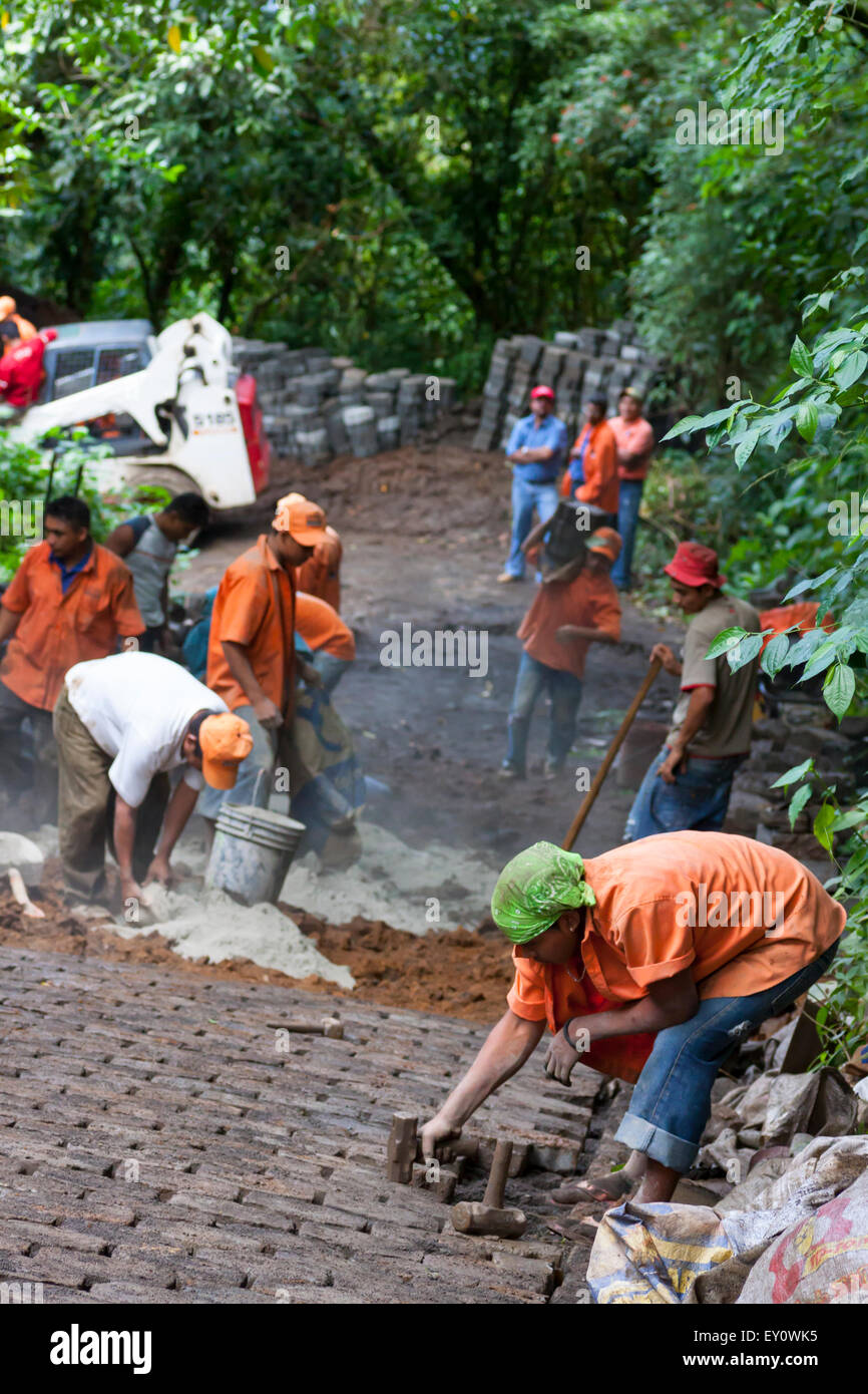Men paving road hi-res stock photography and images - Alamy