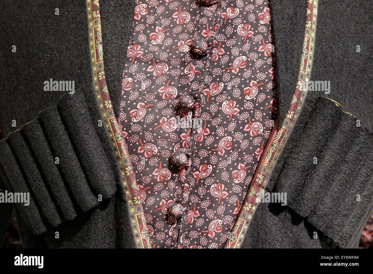 Traditional Caucasian Mtshketoba or Chokha male dress on both sides of ...