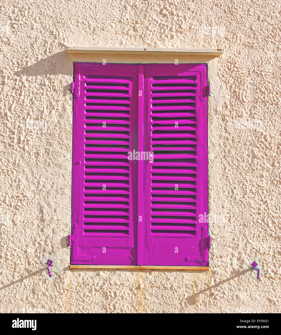 pink window in a beige wall Stock Photo - Alamy