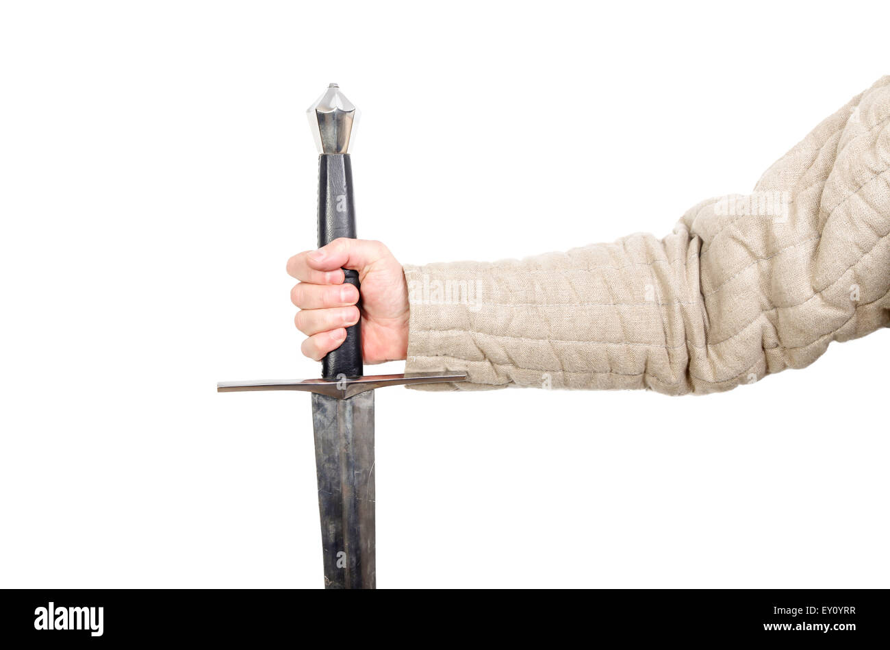 Planting a medieval sword in hand with medieval clothing Stock Photo ...