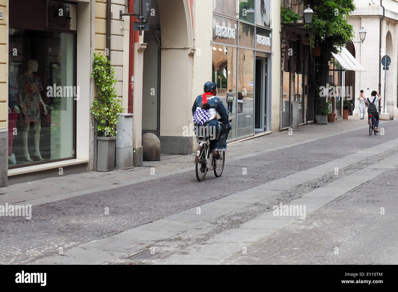 Baby strapped to back hi-res stock photography and images - Alamy