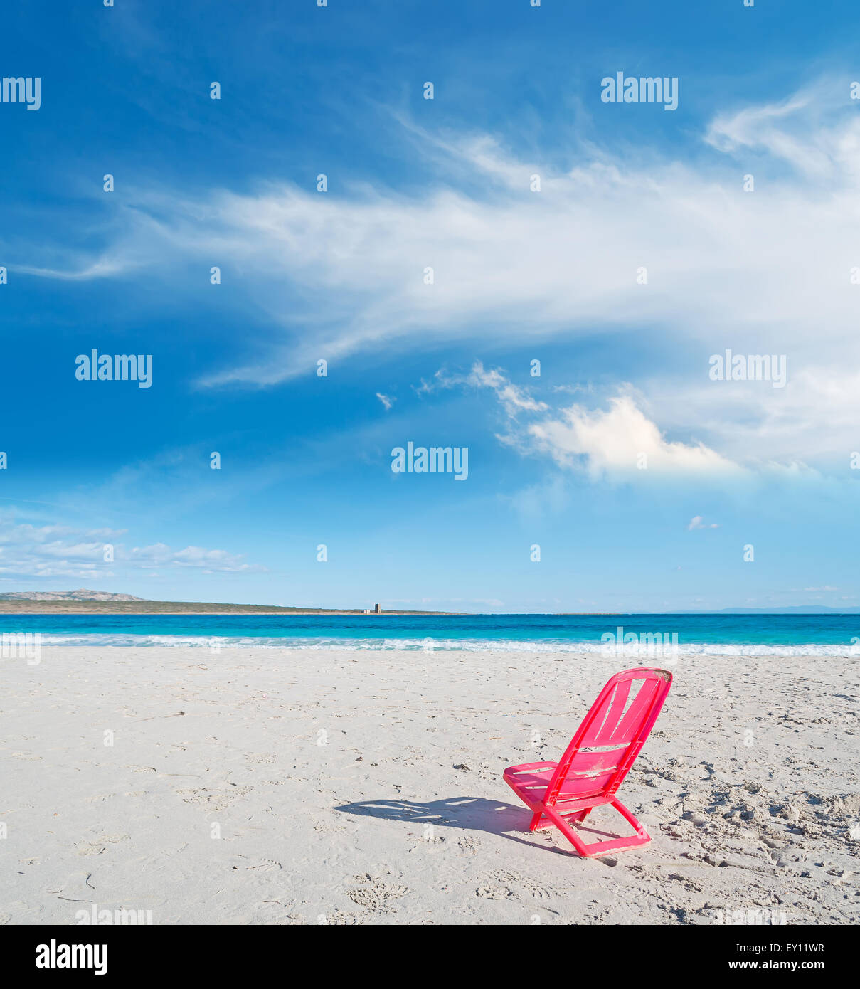 red beach chair on the sand Stock Photo - Alamy